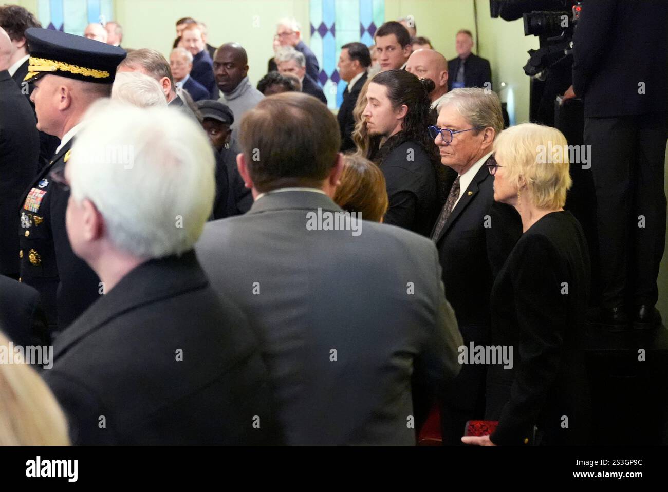 James "Chip" Carter and his wife Becky arrive for the funeral service ...