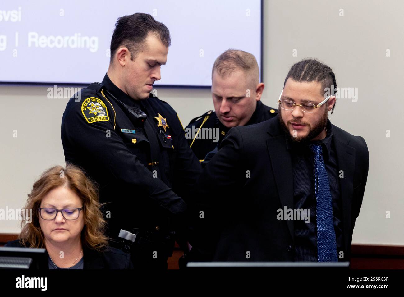 Sheriff's deputies take the handcuffs off of Deondre McLilly as he ...