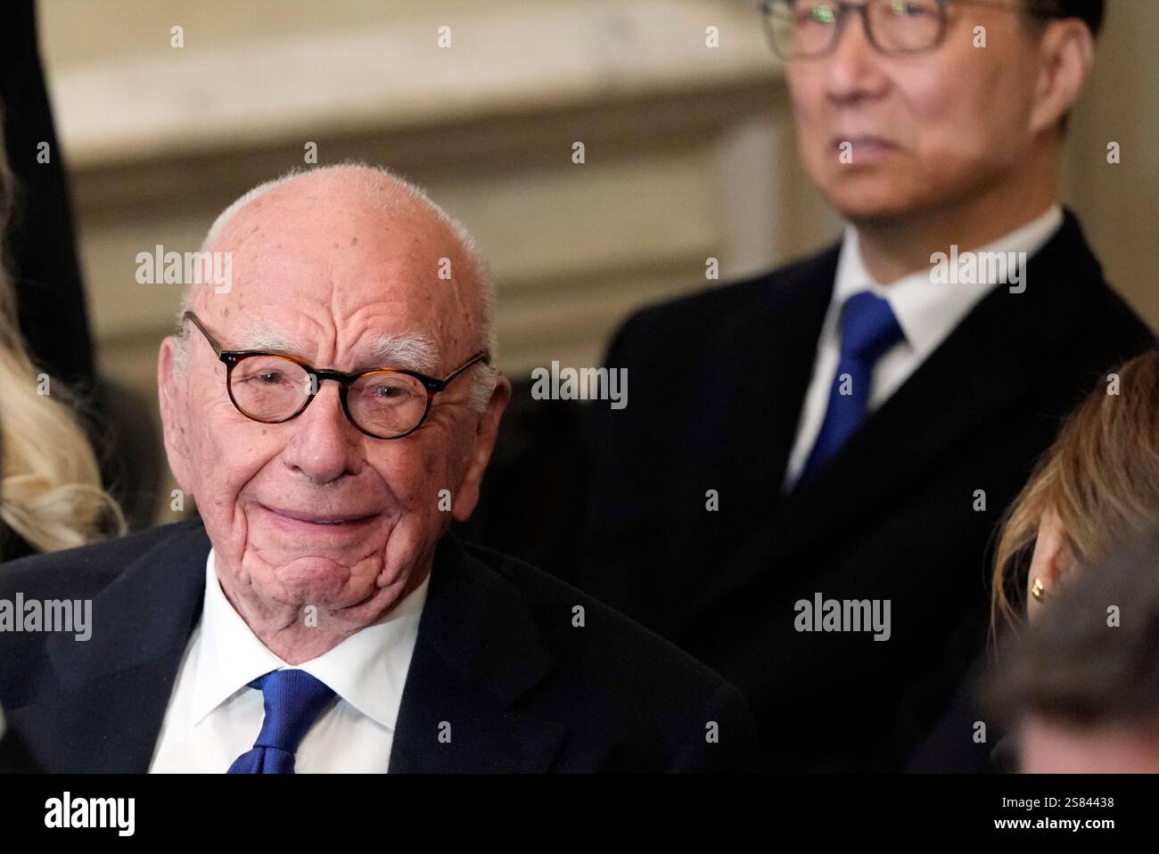 Rupert Murdoch is seen in from of China's Vice President Han Zheng ...