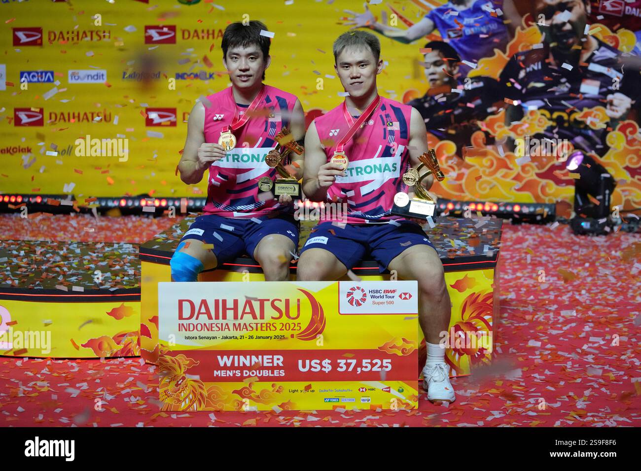 Man Wei Chong, left, and Kai Wun Tee of Malaysia celebrate on the podium with their medals and ...