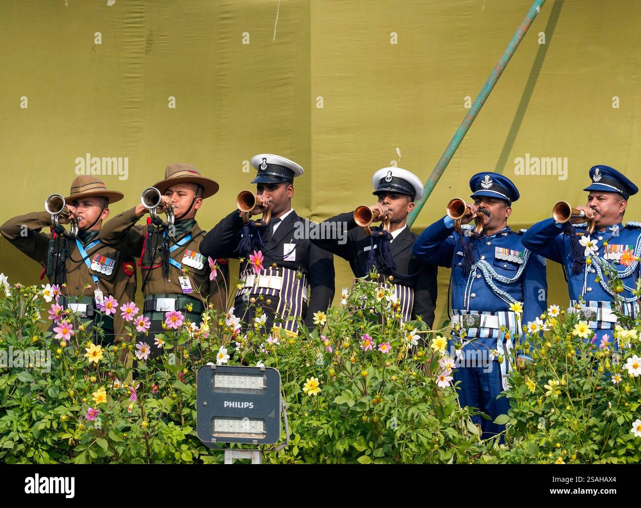 Indian soldiers play the bugle as they pay their respects at Rajghat, a ...