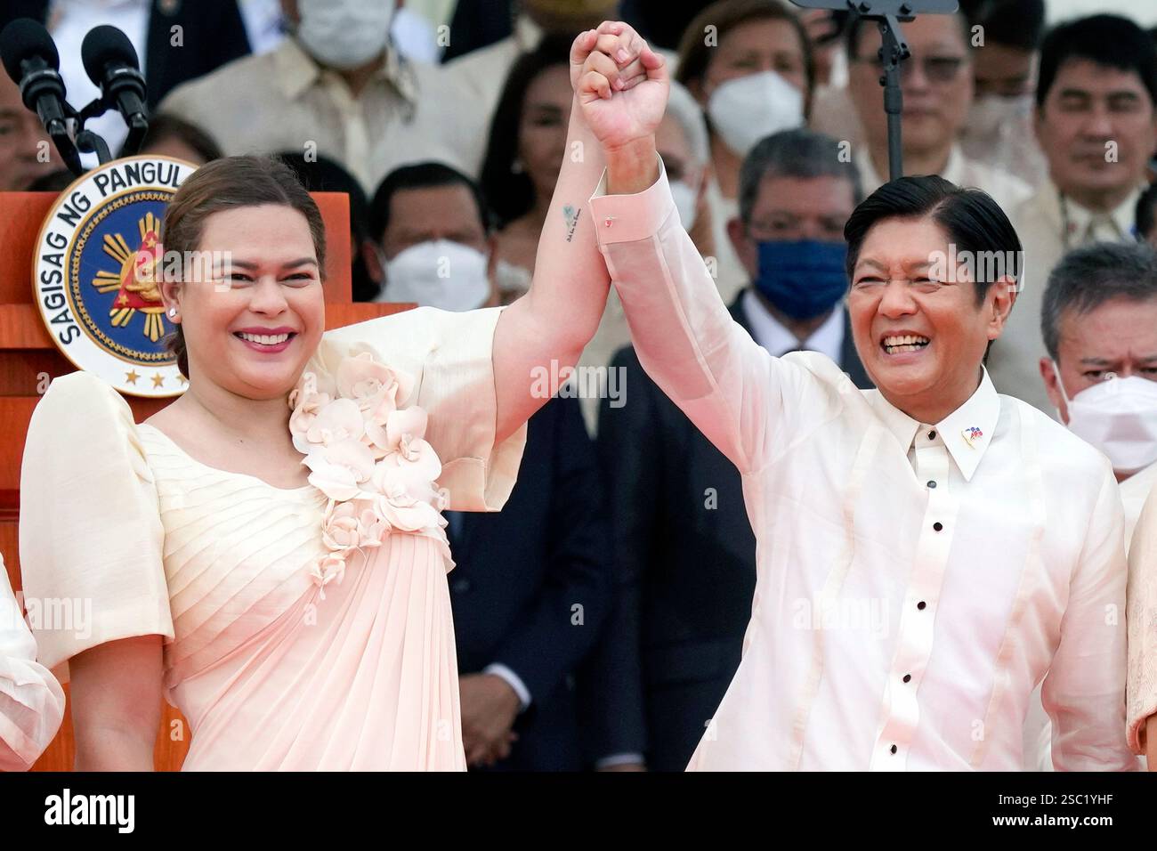 FILE - Philippine President Ferdinand Marcos Jr., center right, and ...
