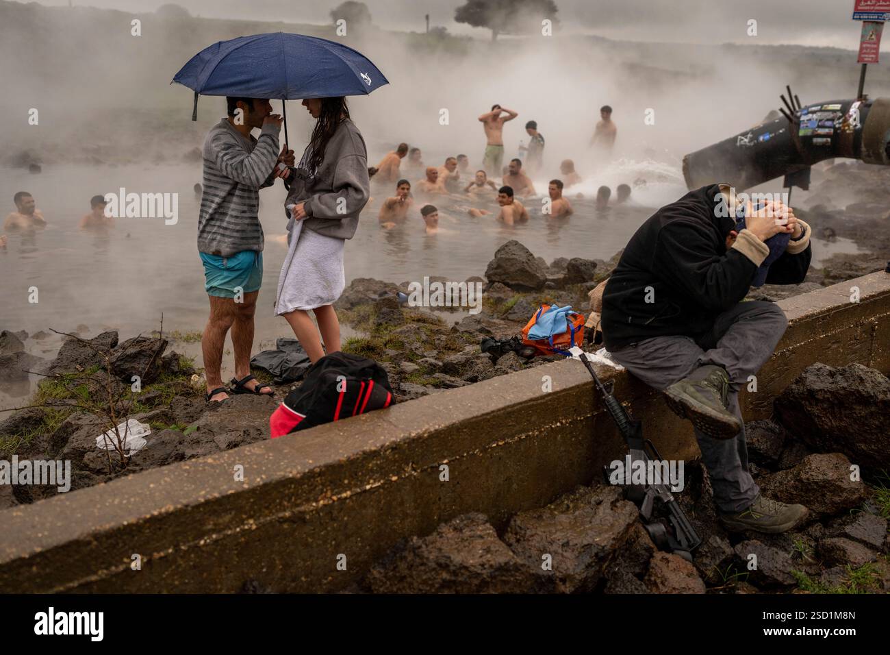 Israeli residents in a hot water pool coming from a drilling project ...