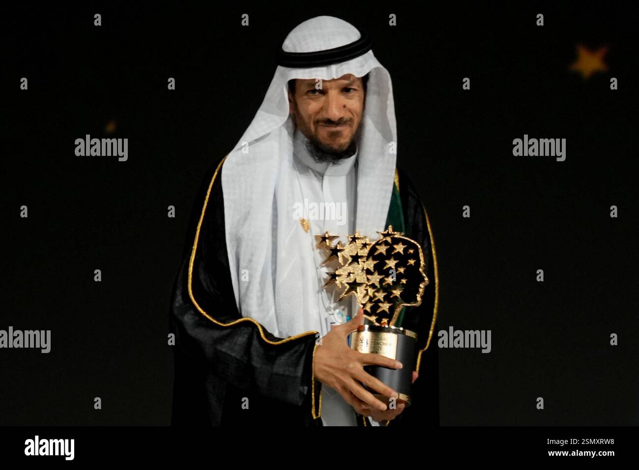 Saudi Arabian teacher Mansour bin Abdullah Al-Mansour, poses with the ... Saudi Arabian teacher Mansour bin Abdullah Al-Mansour, poses with the ...