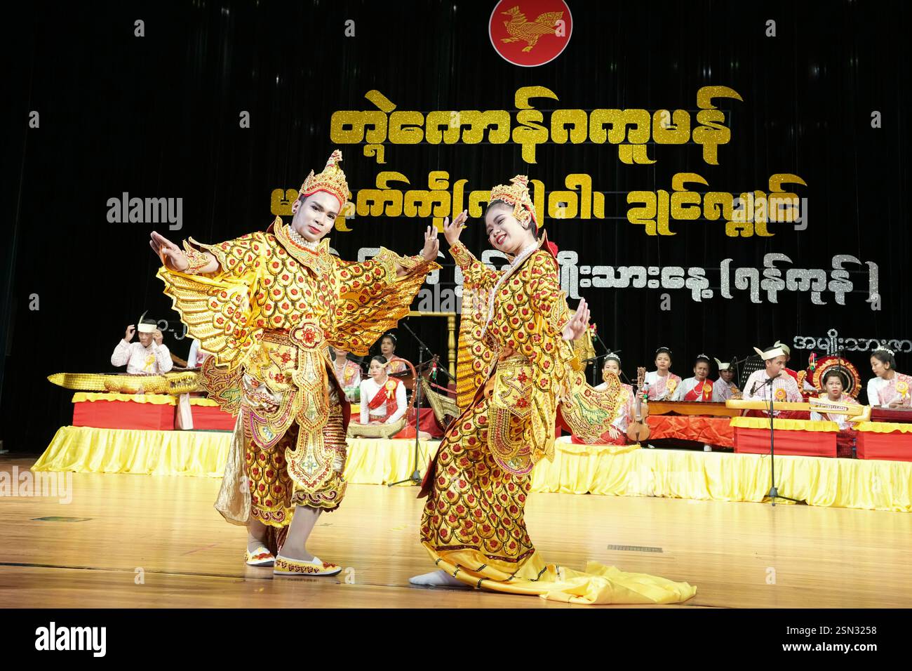 Members of the Mon tribe's artist troupe perform a traditional dance ...