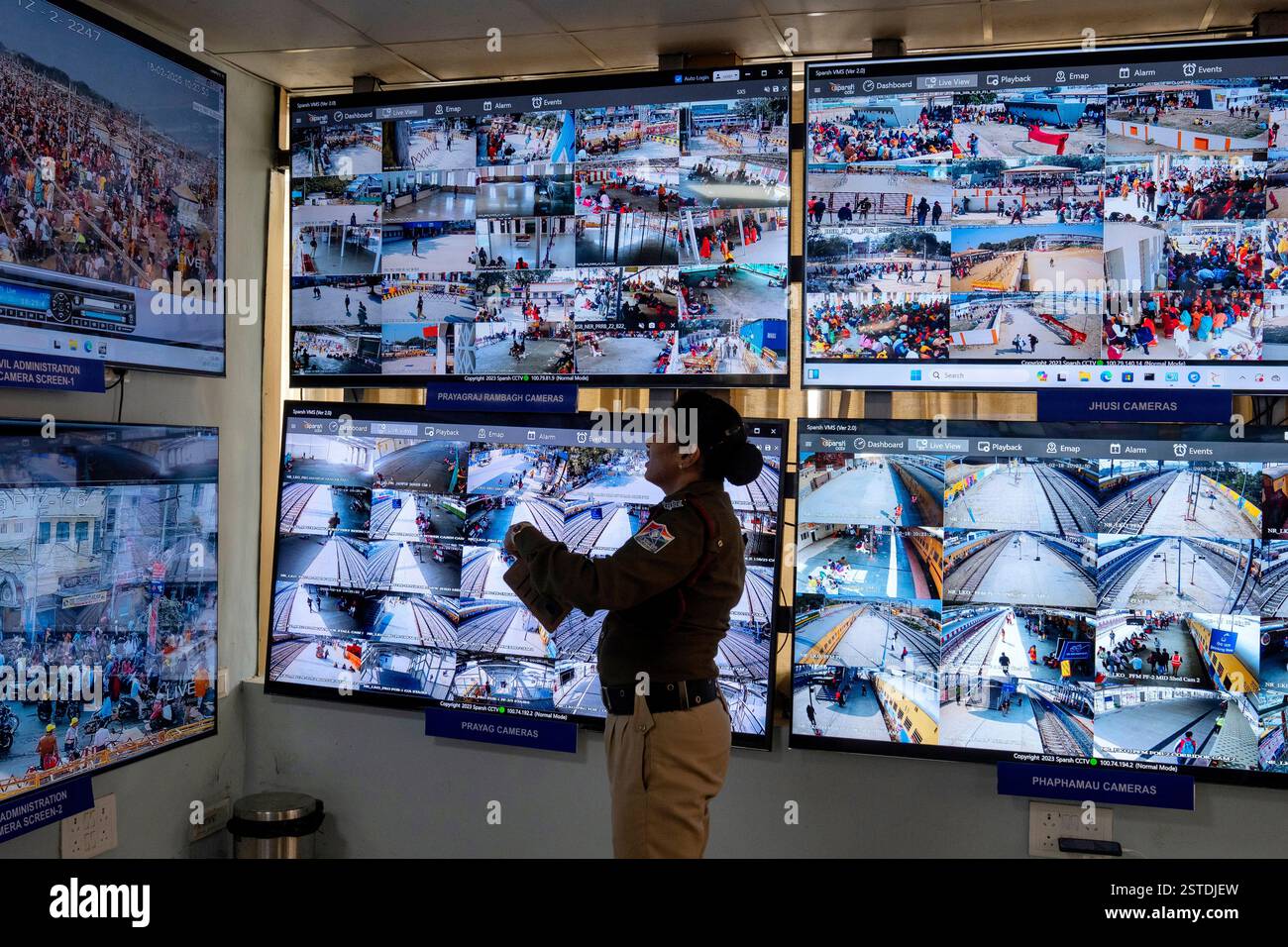 An Indian police women (RPF) looks CCTV at the movement Command Control ...