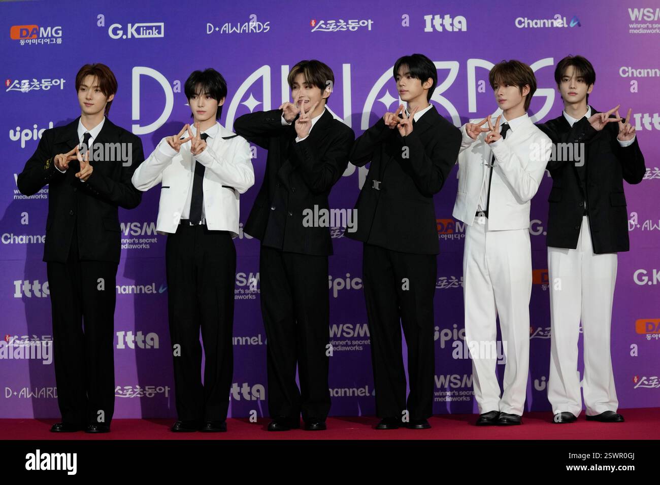 Members of South Korean K-Pop group TWS pose for photos during the D ...