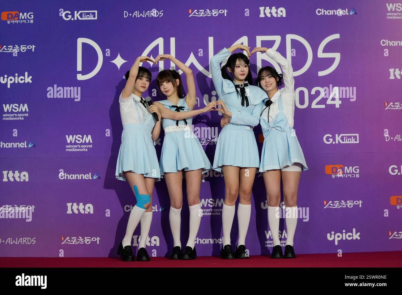 Members of South Korean K-Pop group QWER pose for photos during the D Awards at Korea University ...