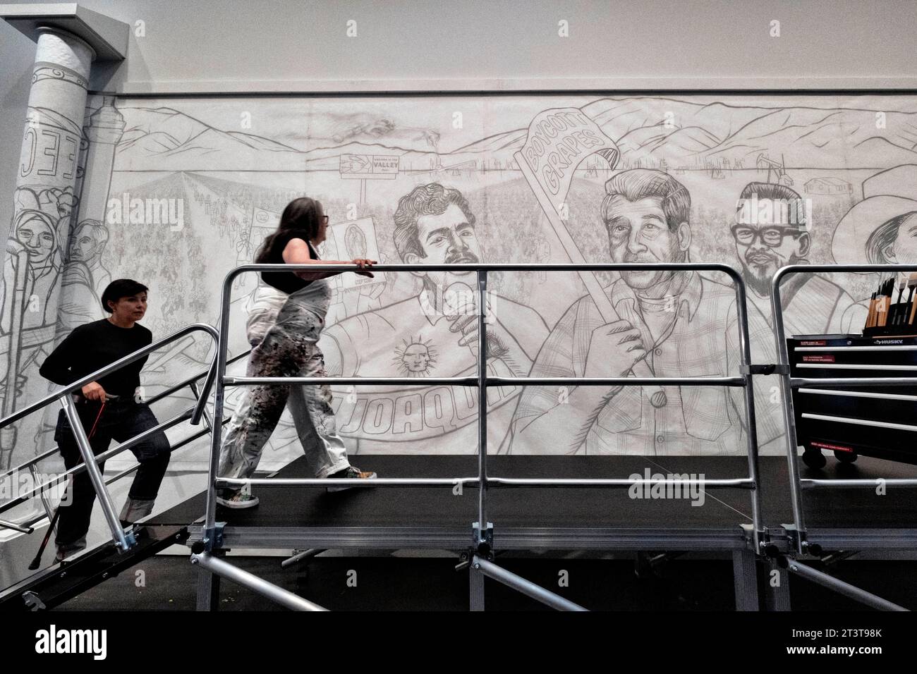 Artist Judy Baca climbs a scaffold to begin work on her mural along ...