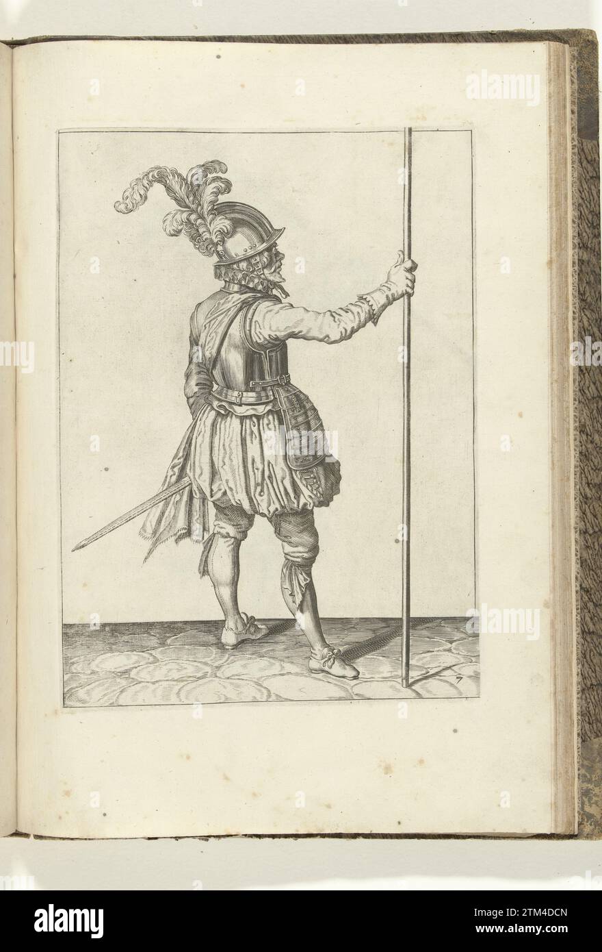 Soldato, visto sulla schiena, tenendo le spie con la mano destra in ...