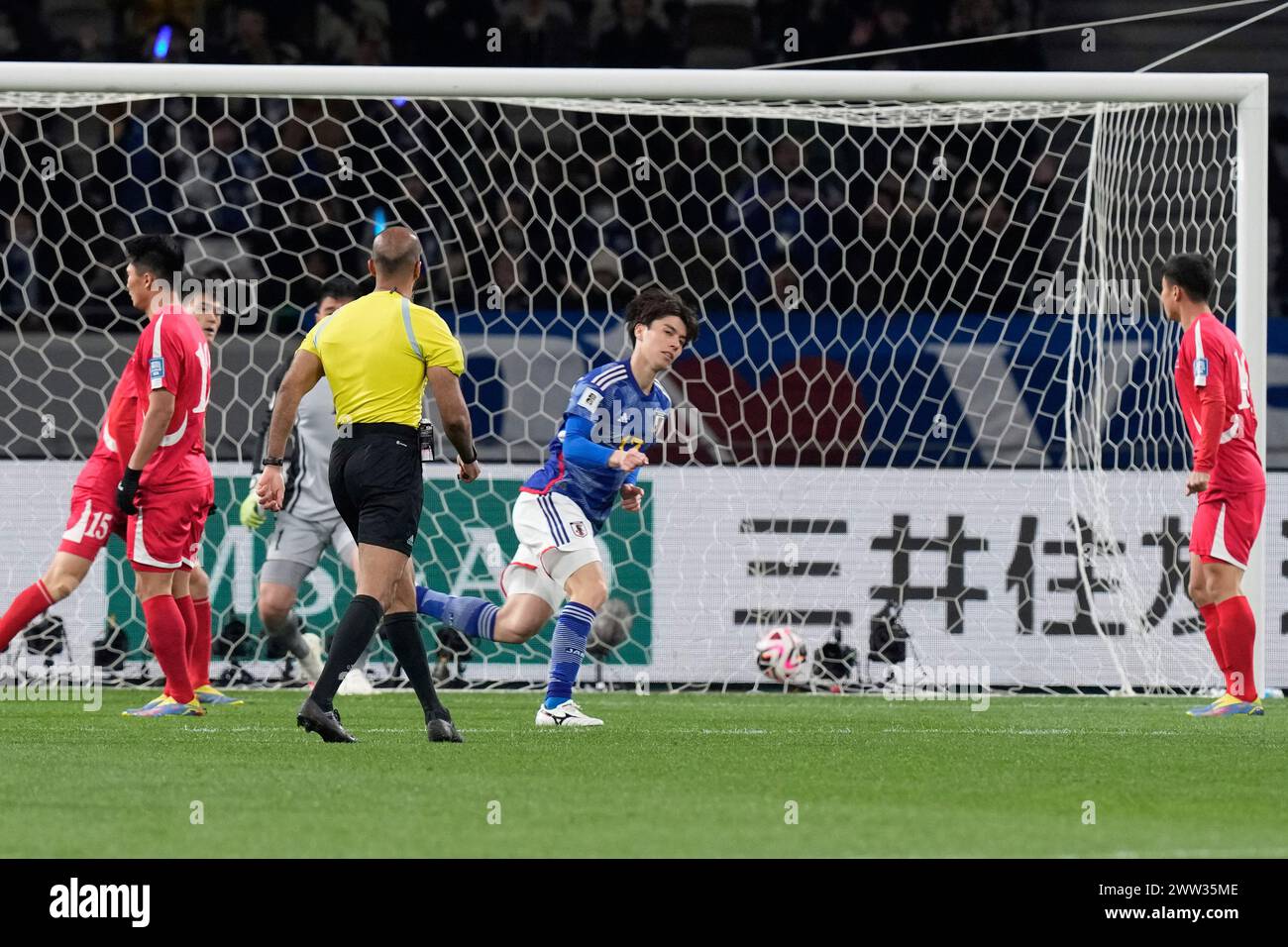 Japan's Ao Tanaka, centre, celebrates after scoring the first goal for ...