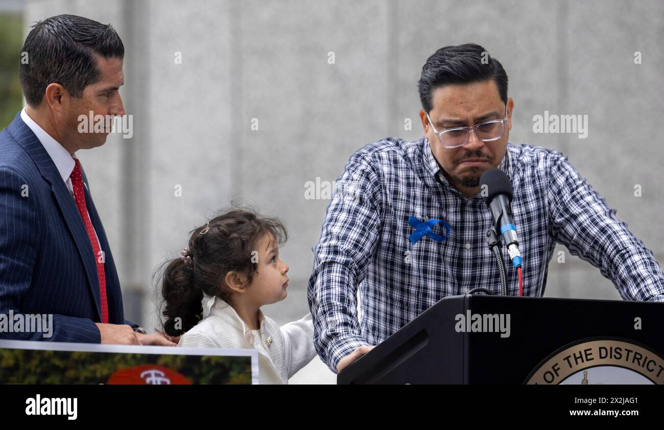 James Alvarez, right, is comforted by his 3-year-old "miracle baby ...