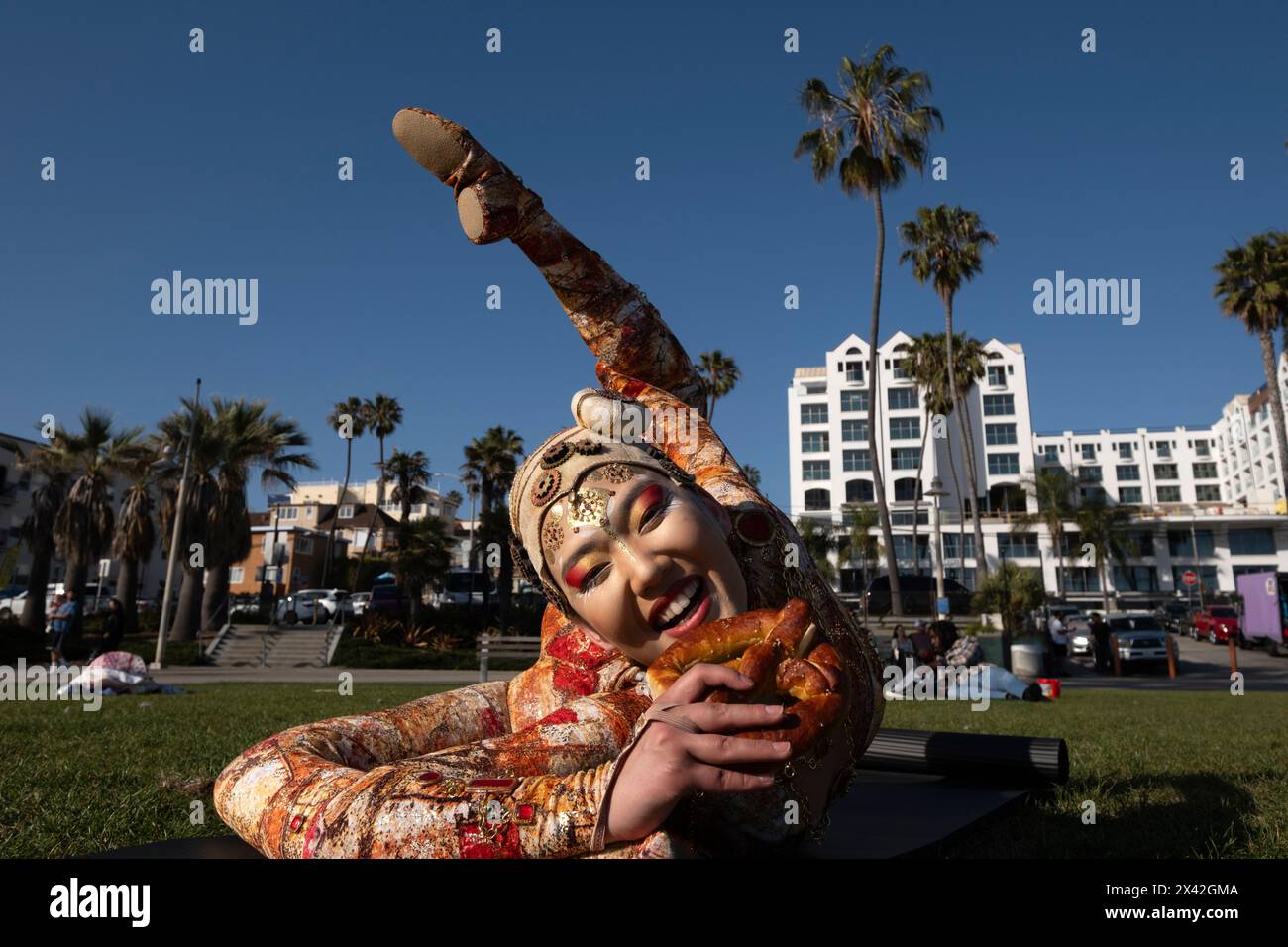 Cirque du Soleil contortionist Sender Enkhtur takes a bite on a pretzel ...