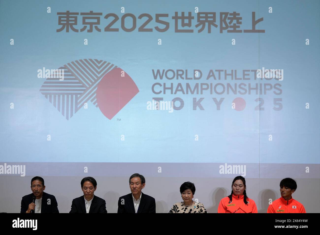 From left, Ryo Nakagawa, a designer of the selected logo, Masahiko Kimura, the logo design ...