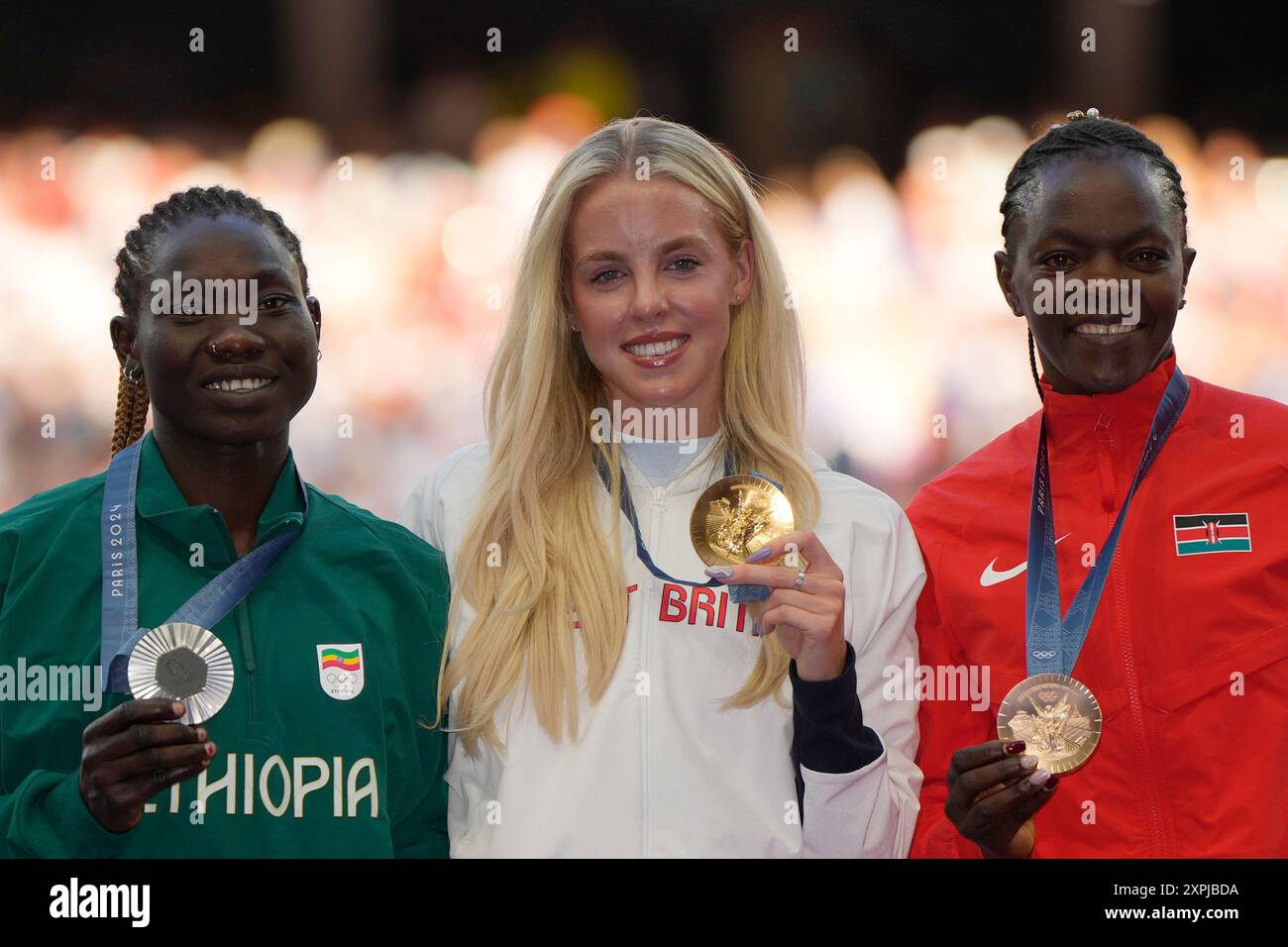 Silver medalist Tsige Duguma, of Ethiopia, from left, gold medalist ...