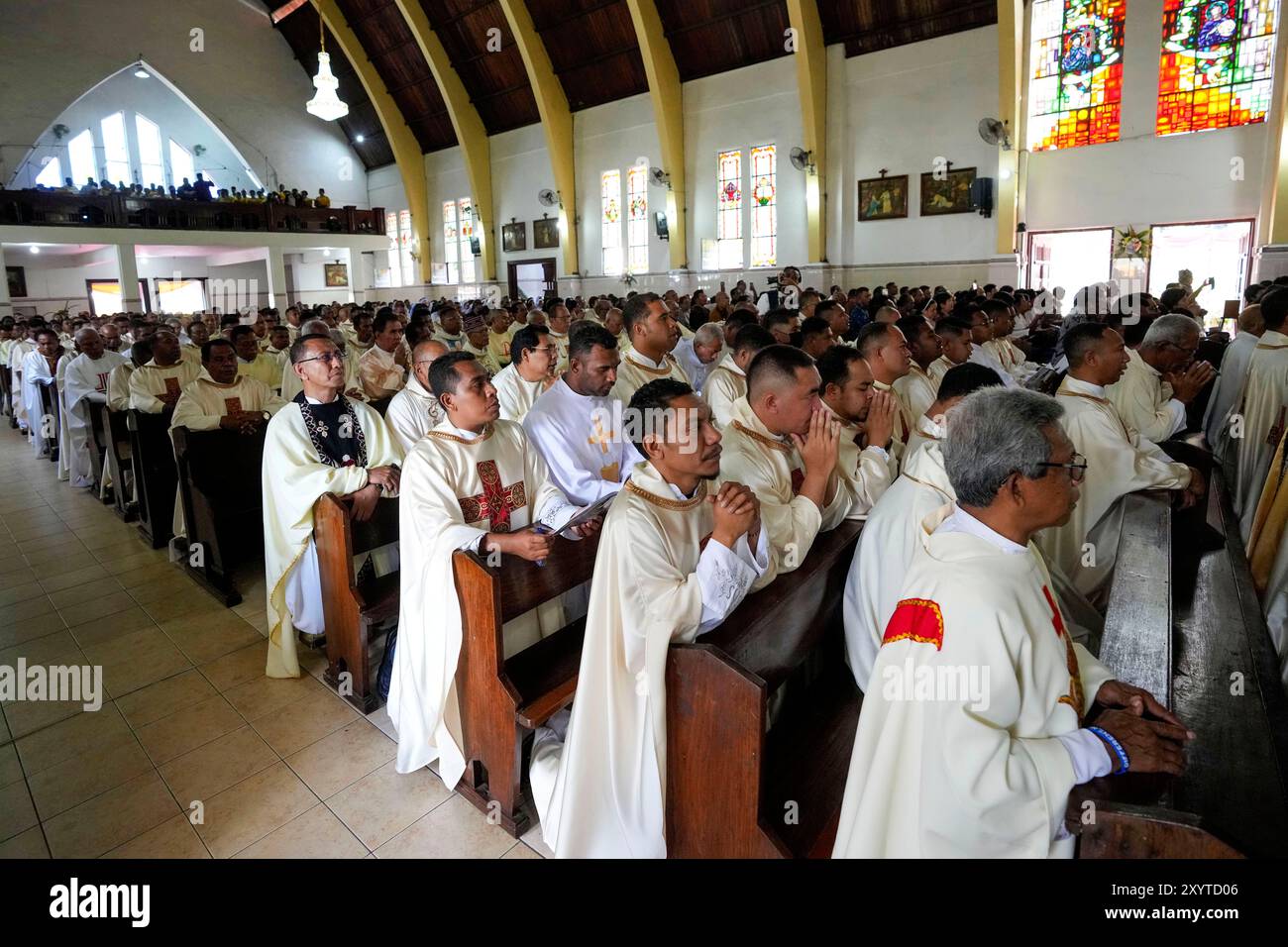 Catholic priests attend the ordination ceremony of Paulus Budi Kleden ...
