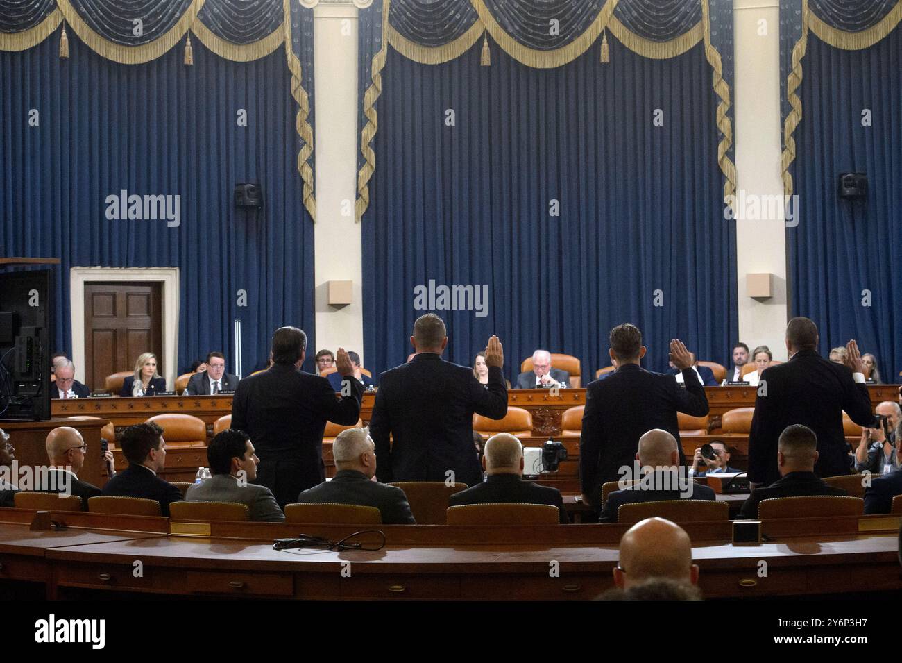 Witnesses stand to be sworn-in from left, Dr. Ariel Goldschmidt ...