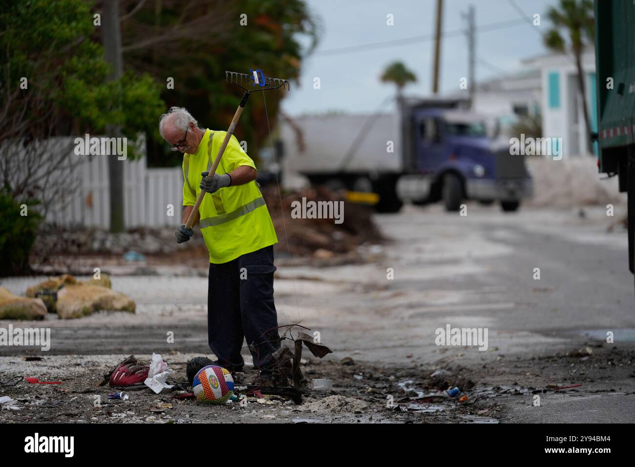 Teams work to clean up piles of debris from Hurricane Helene flooding ...