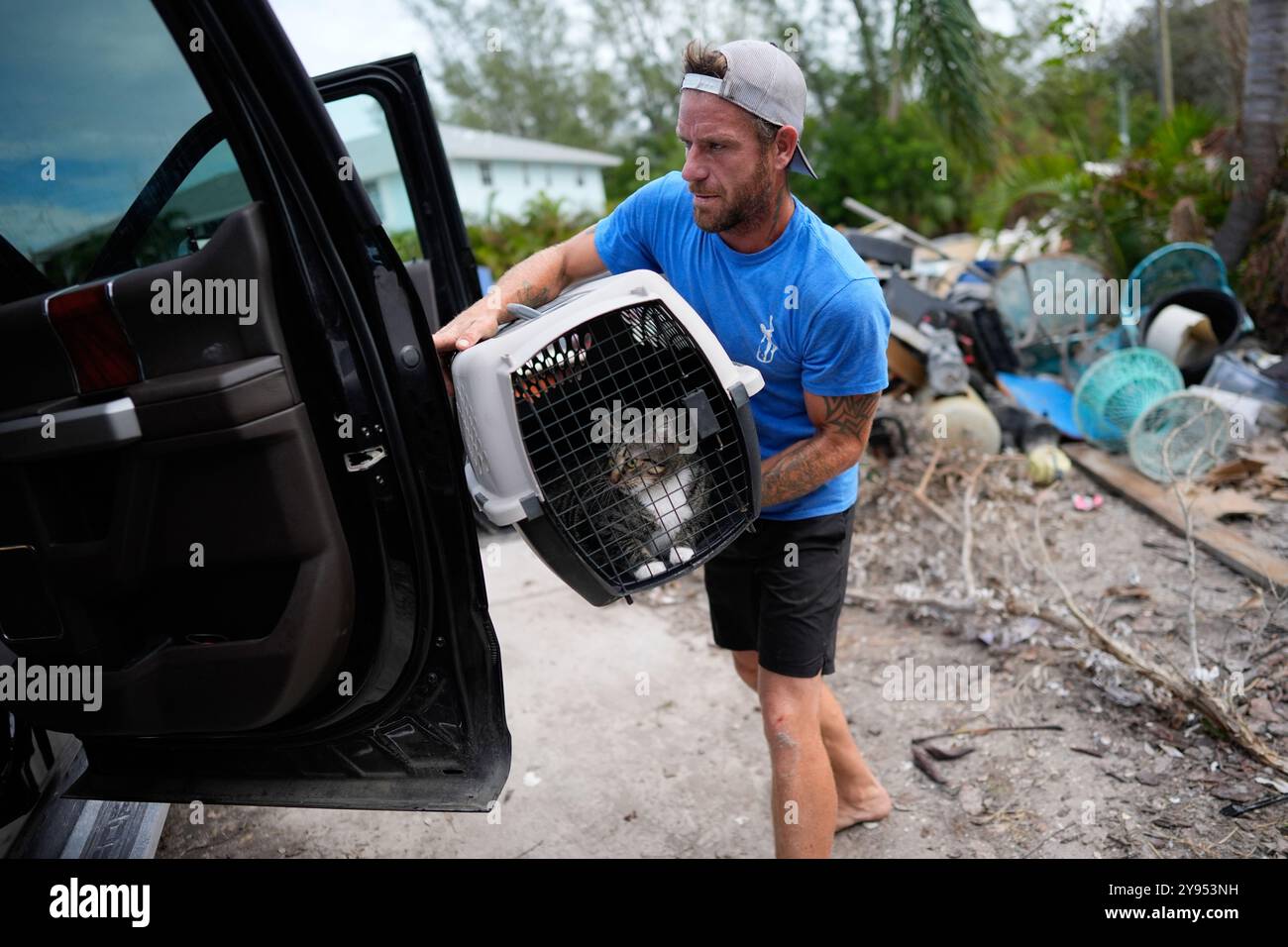 Ted Carlson puts his best friend Evan Purcell's cat McKenzie into a ...
