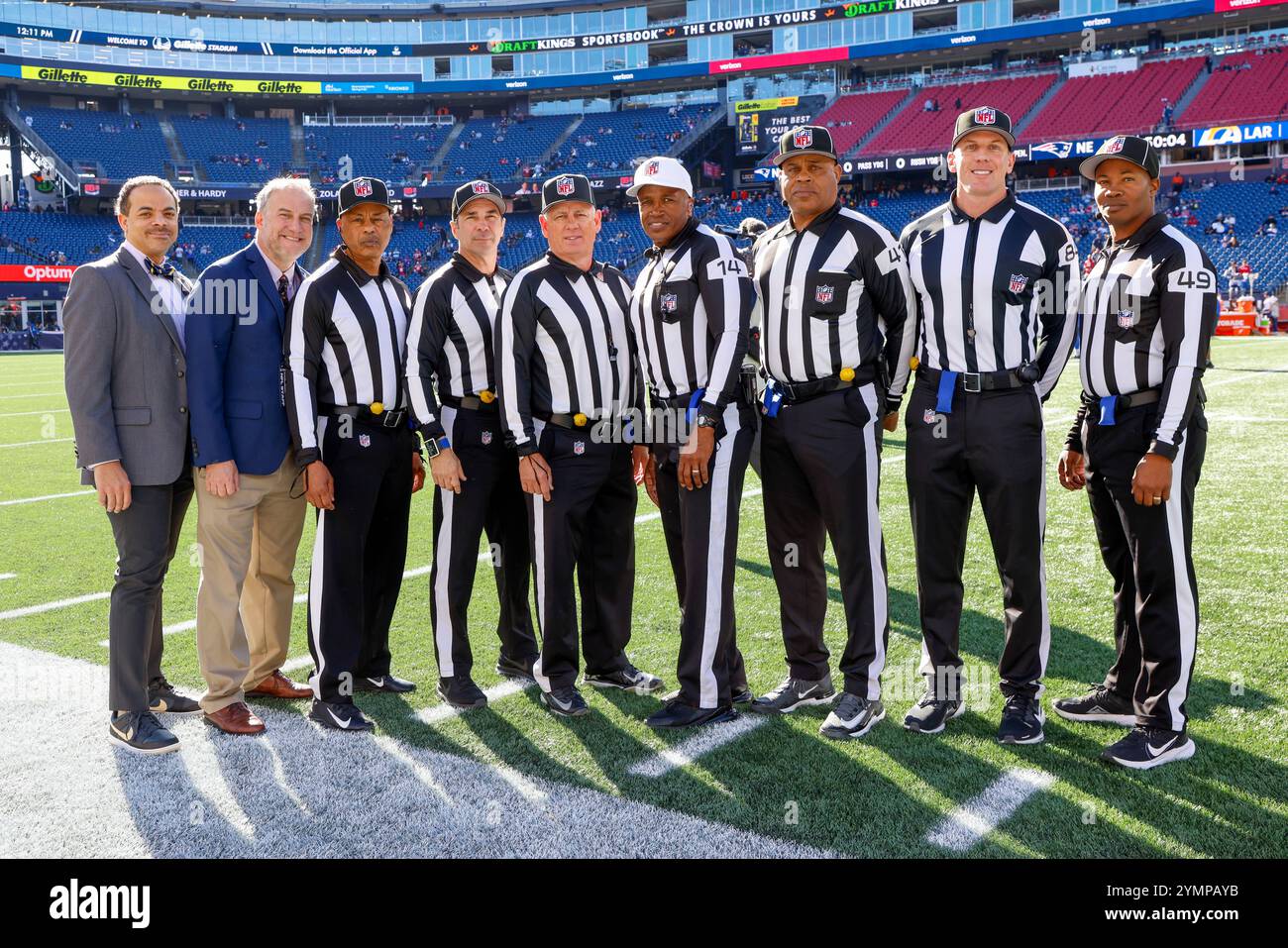 From left to right Larry Hill, Mike Wimmer, field judge Dyrol Prioleau ...