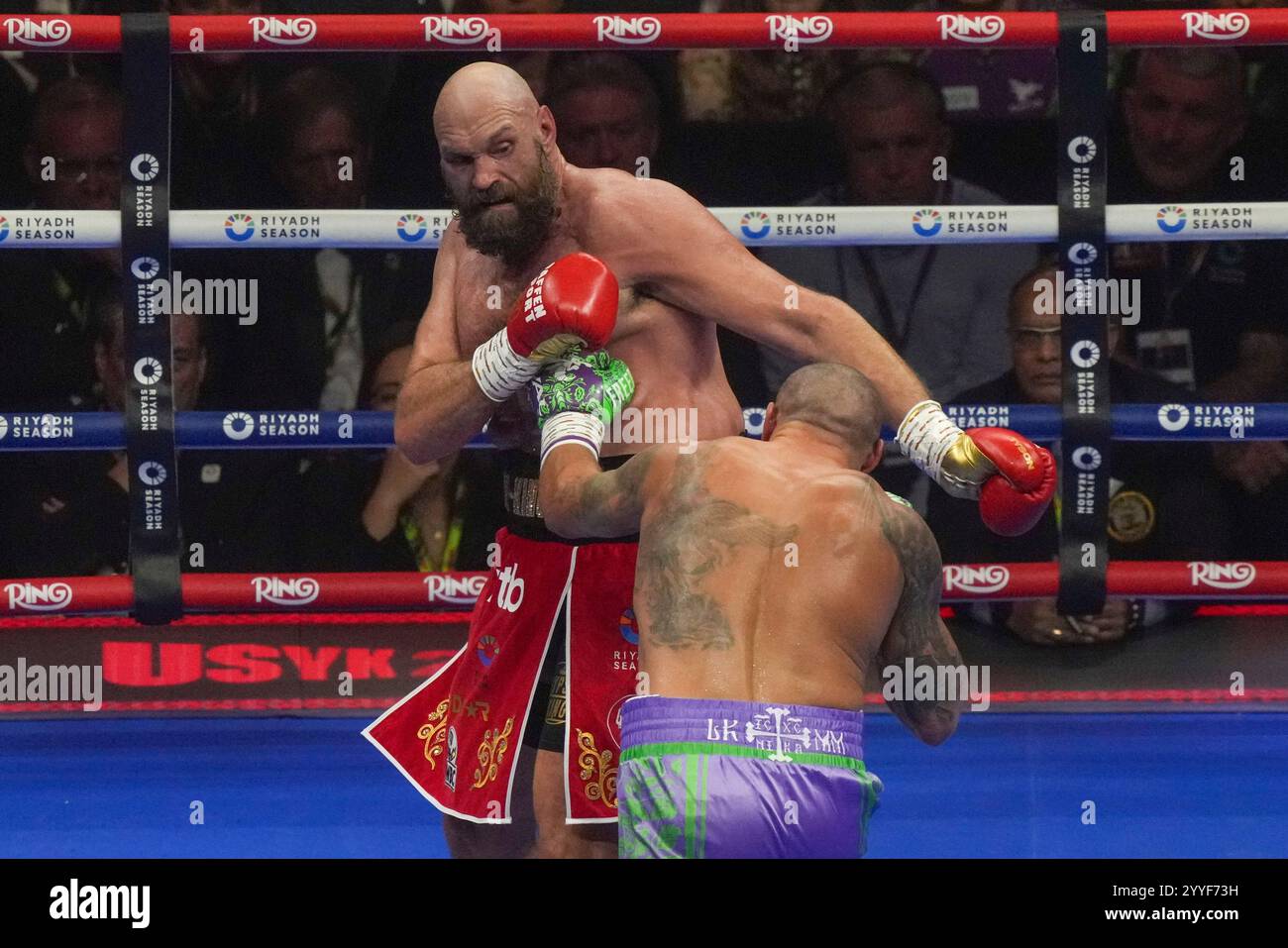 Boxers Britain's Tyson Fury, left, and Ukraine's Oleksandr Usyk compete ...