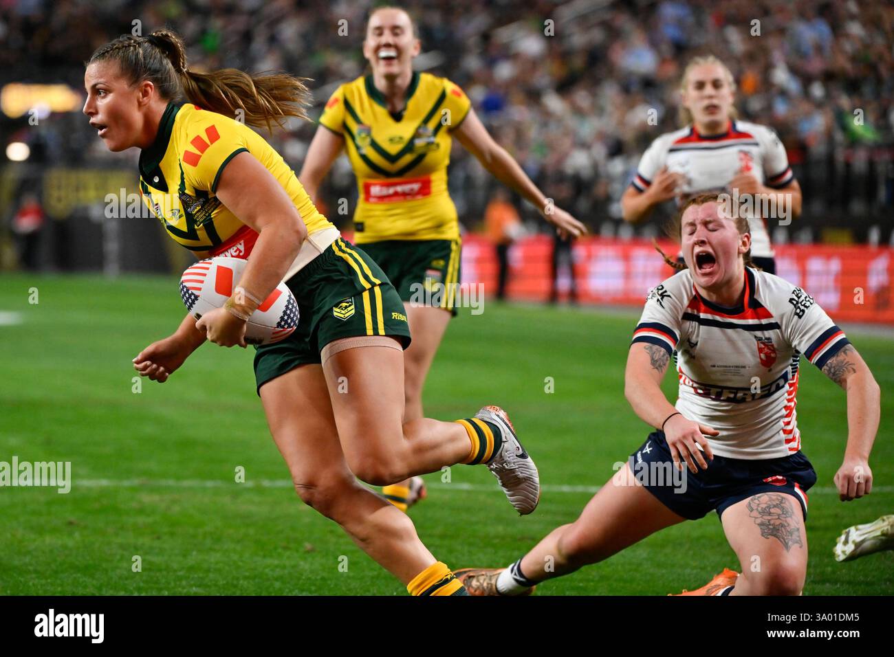 Australian Jillaroo Jessica Sergis, left, beats a defender on her way ...