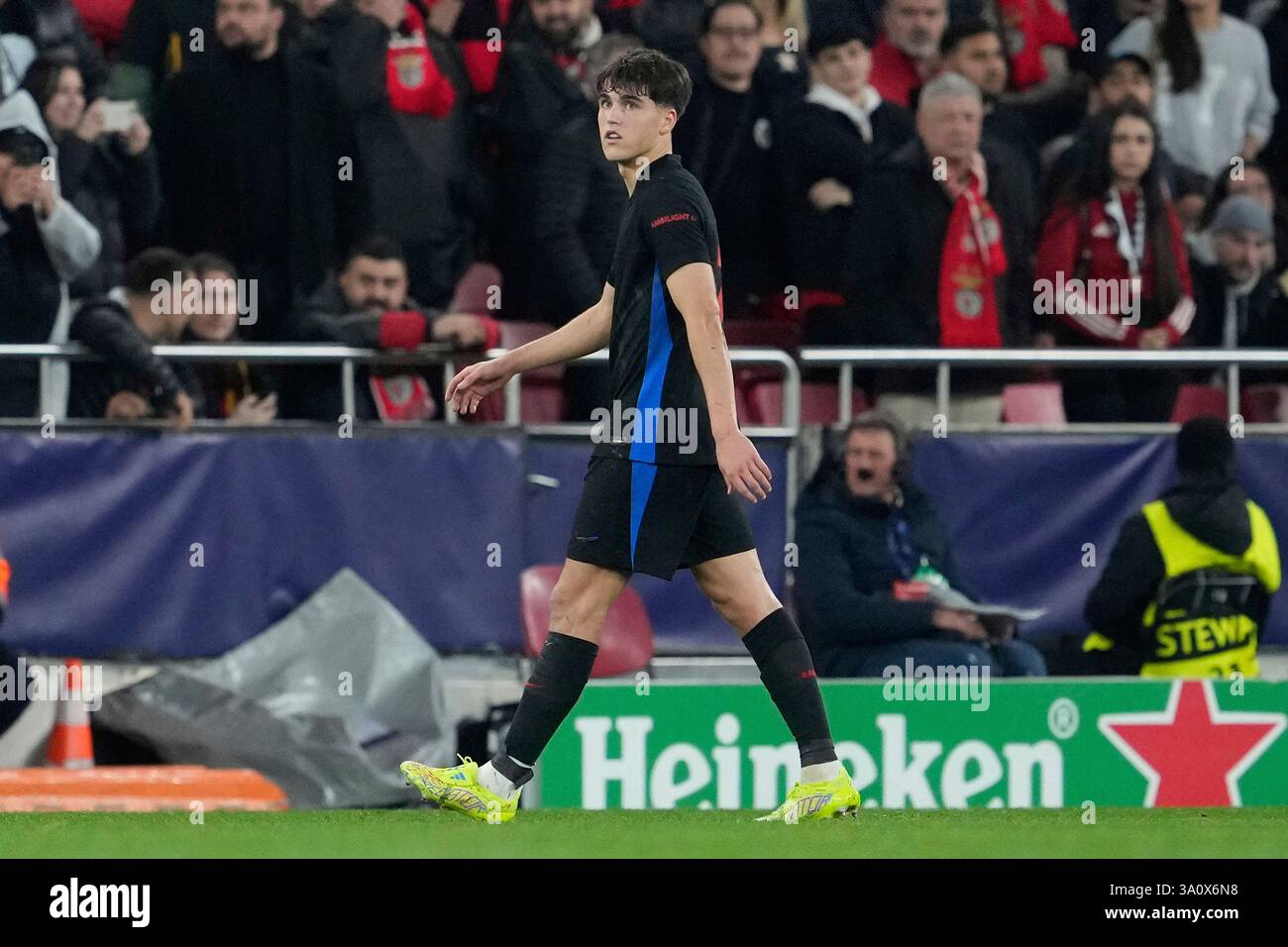 Barcelona's Pau Cubarsi walks off the pitch after receiving a red card ...