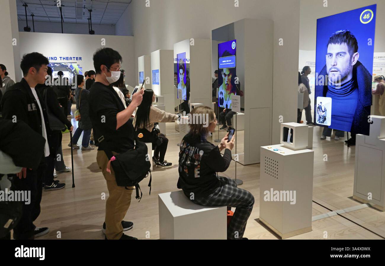 Visitors enjoy the facial tracking mirror of "Capcom Creation –moving ...