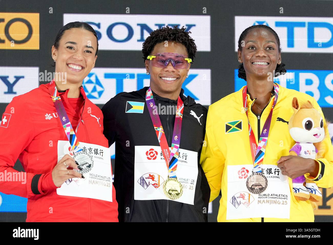 Silver medalist Ditaji Kambundji, of Switzerland, gold medalist Devynne Charlton, of Bahamas ...