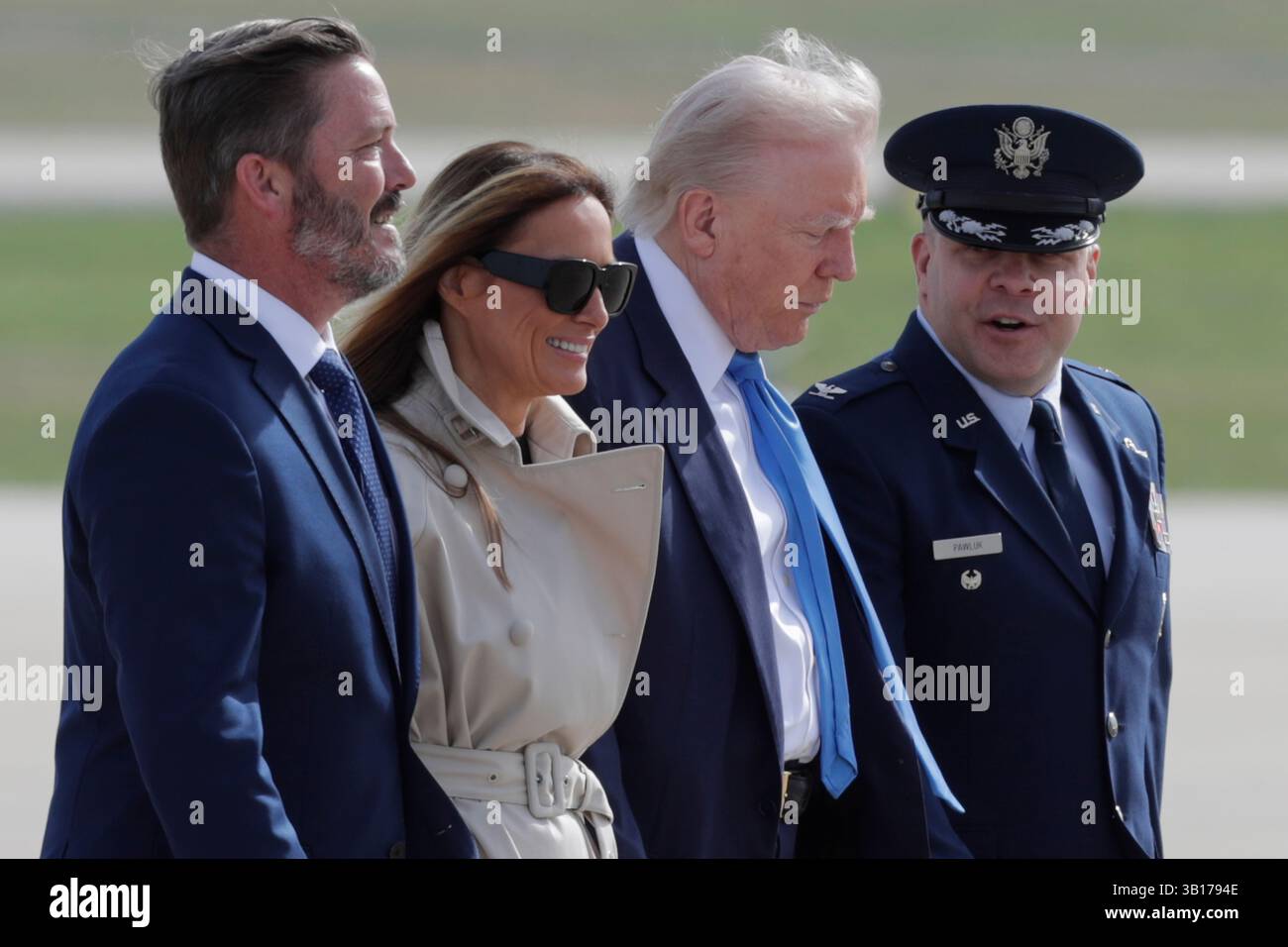 President Donald Trump, second from right, is escorted by Col. Paul ...