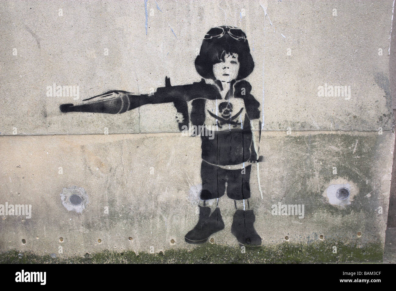 Banksy street art graffiti che mostra il bambino con propulsione a ...