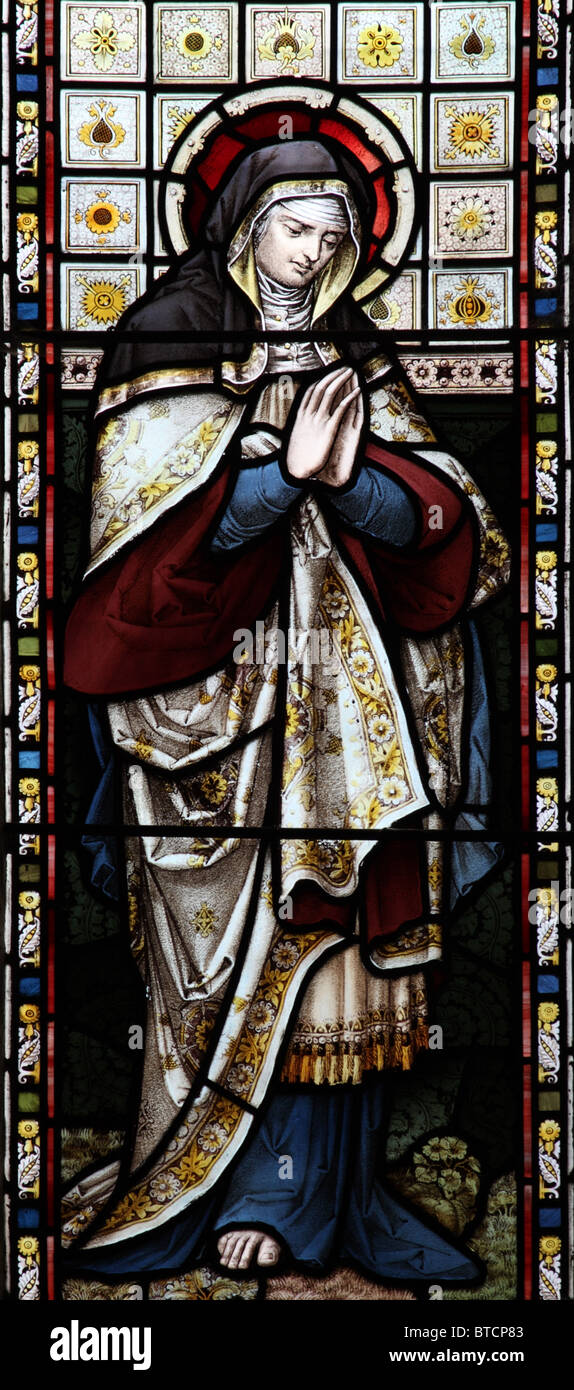 Una finestra di vetro colorato da A. L. Moore raffigurante la Vergine ...