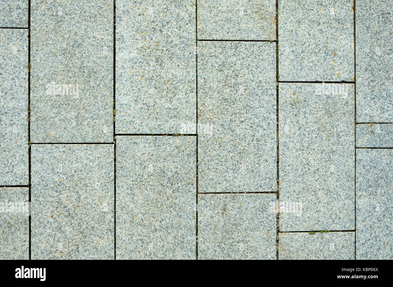 Pavimentazione in piastrelle di pietra di granito. La texture della ...